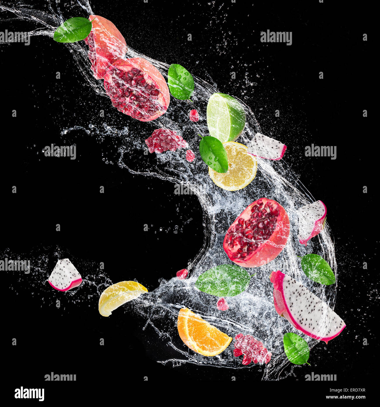 Fresh fruit with water splash on dark background Stock Photo - Alamy