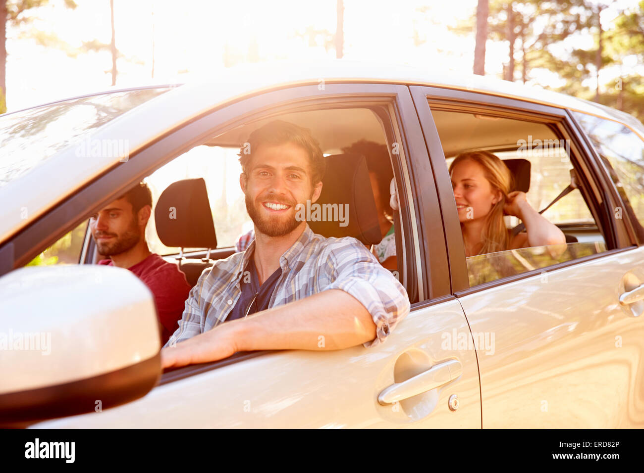Group Of Friends In Car On Road Trip Together Stock Photo - Alamy