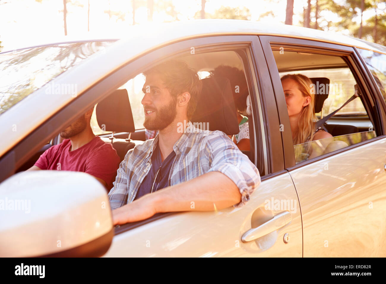 Group Of Friends In Car On Road Trip Together Stock Photo - Alamy
