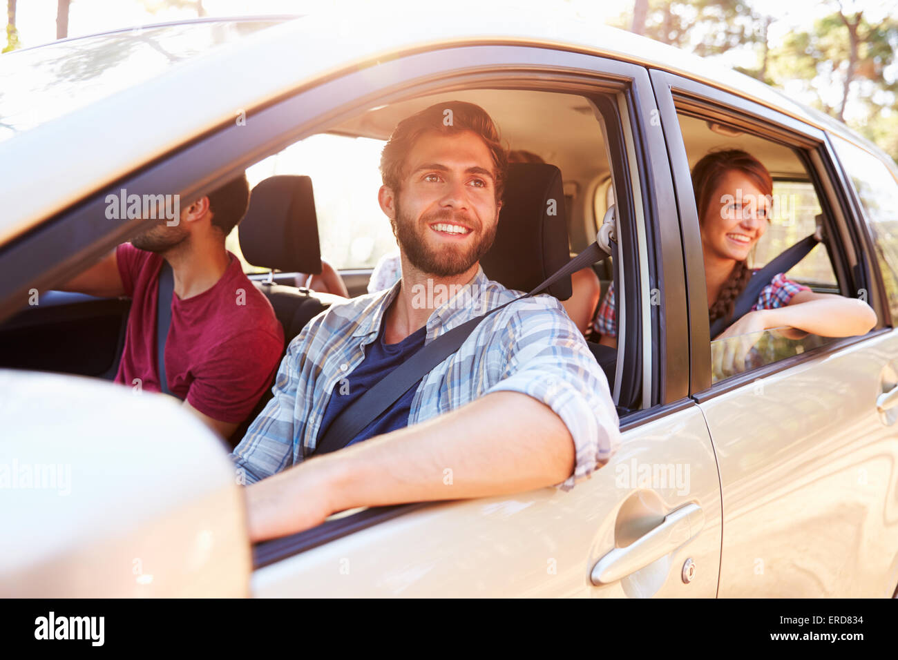 Group Of Friends In Car On Road Trip Together Stock Photo - Alamy