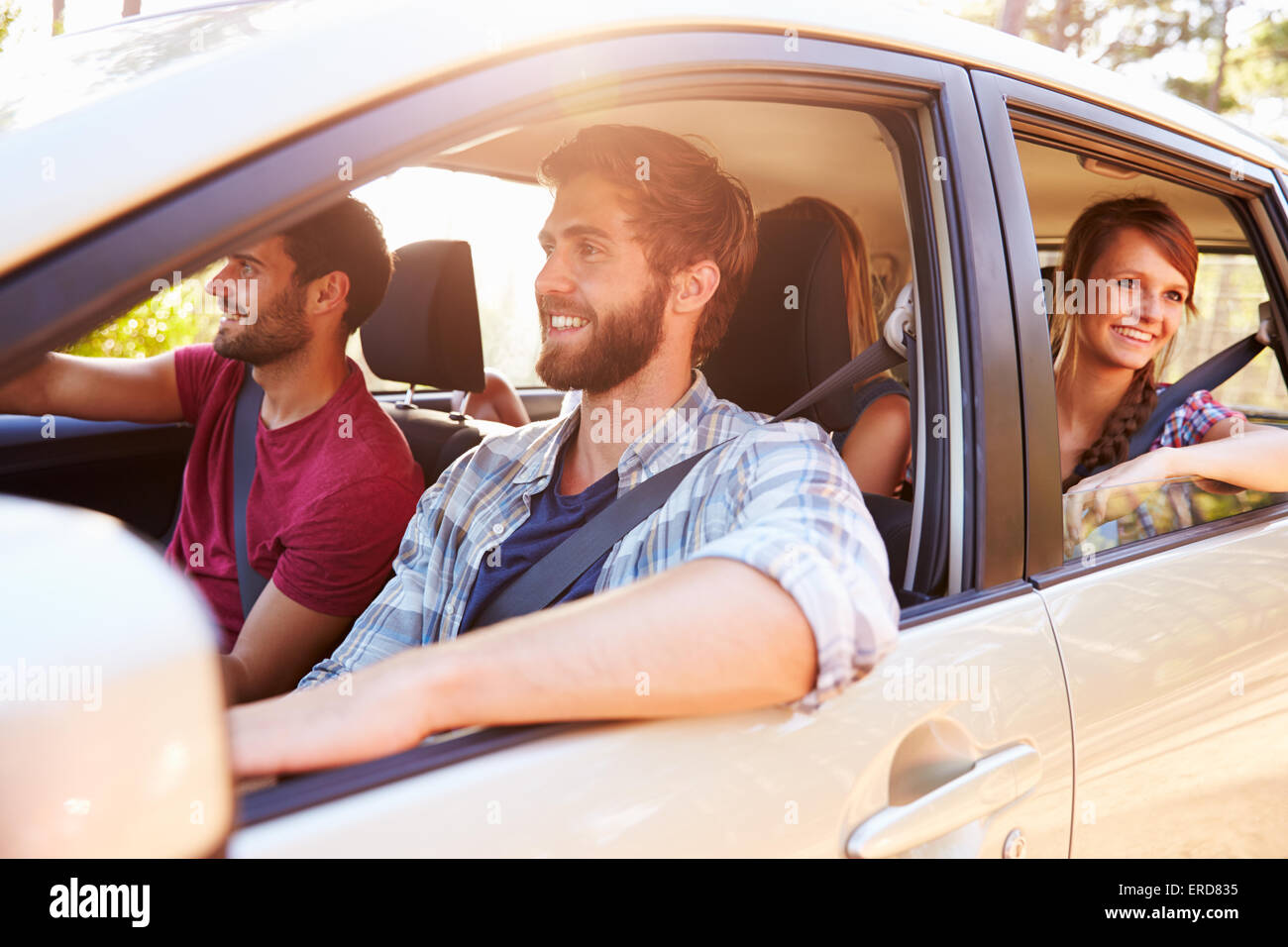 Group Of Friends In Car On Road Trip Together Stock Photo - Alamy