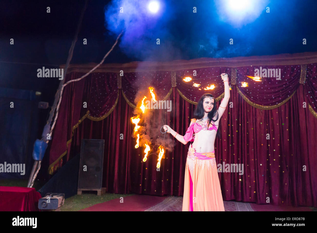 Full Length of Exotic Dark Haired Fire Dancer Wearing Bright Costume ...