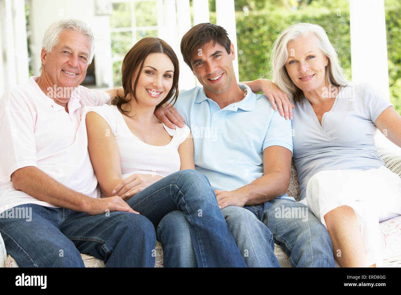 Portrait Of Mature Parents Relaxing With Grown Up Children Stock Photo ...