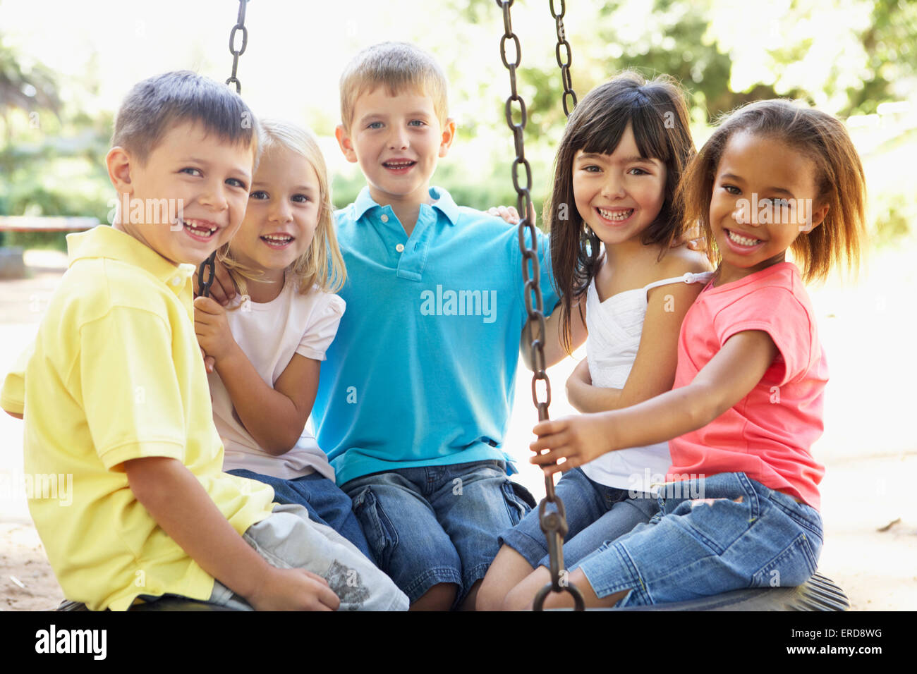 Group Of Children Having Fun In Playground Together Stock Photo - Alamy