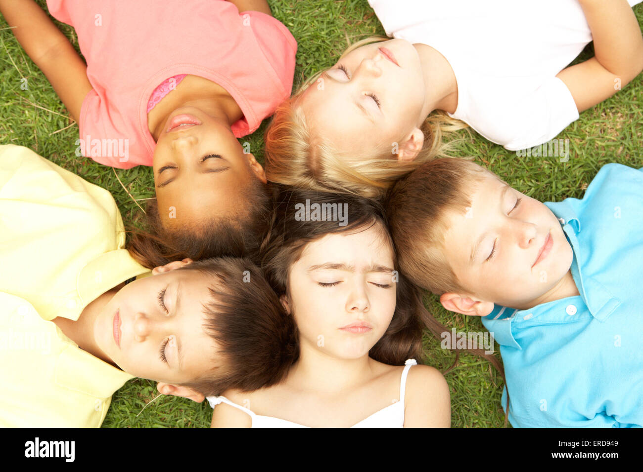 Overhead View Of Group Of Resting Children Stock Photo - Alamy