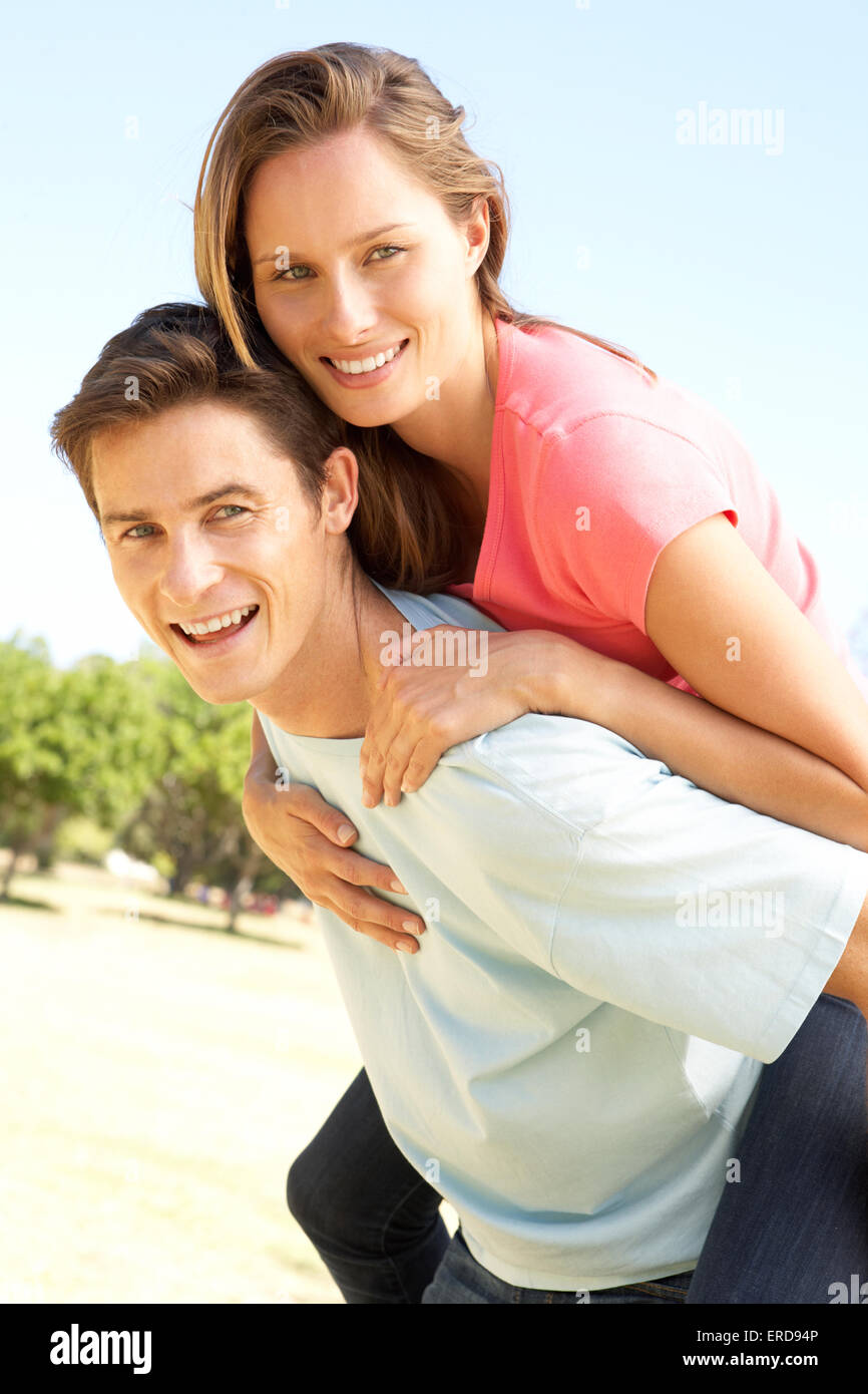 Young Couple Having Fun Piggyback Ride Stock Photo - Alamy