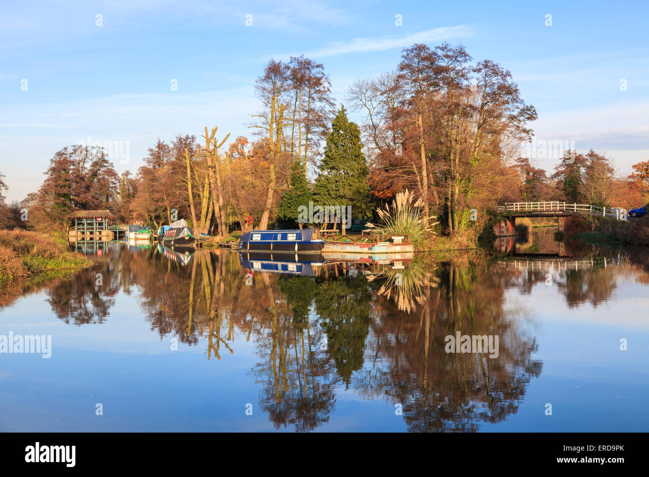 River Wey at Pyrford, Surrey, UK with narrowboats and reflections of ...