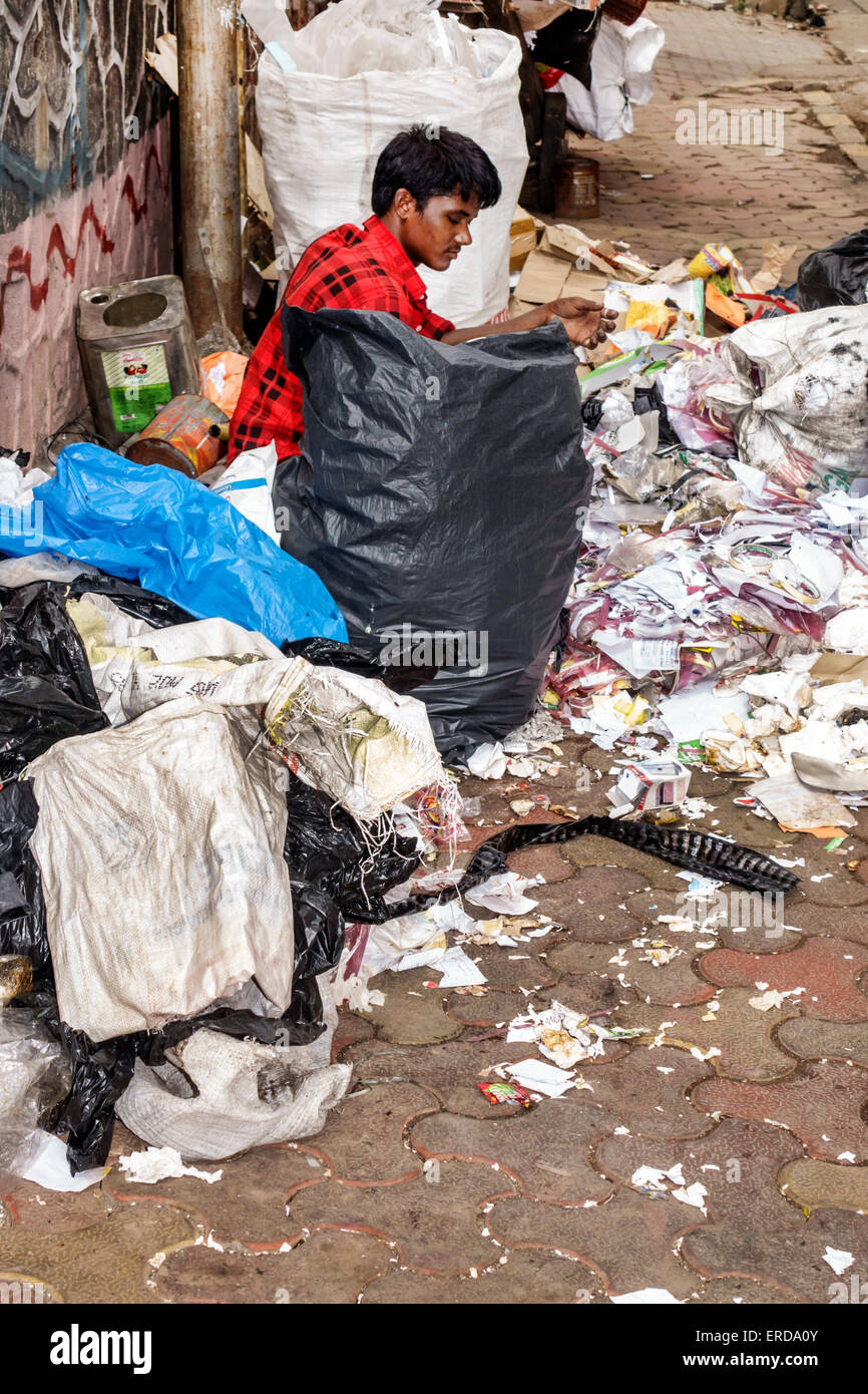 Mumbai India,Lower Parel,man men male,trash,separating,paper,pile ...