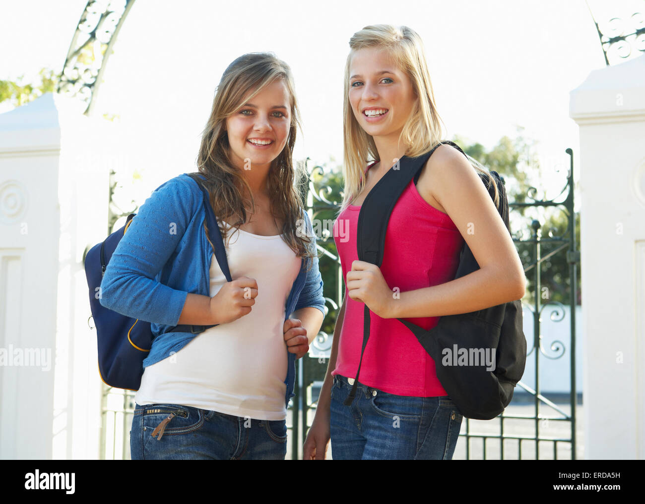 Two Female College Students Standing Outside Gate Stock Photo - Alamy