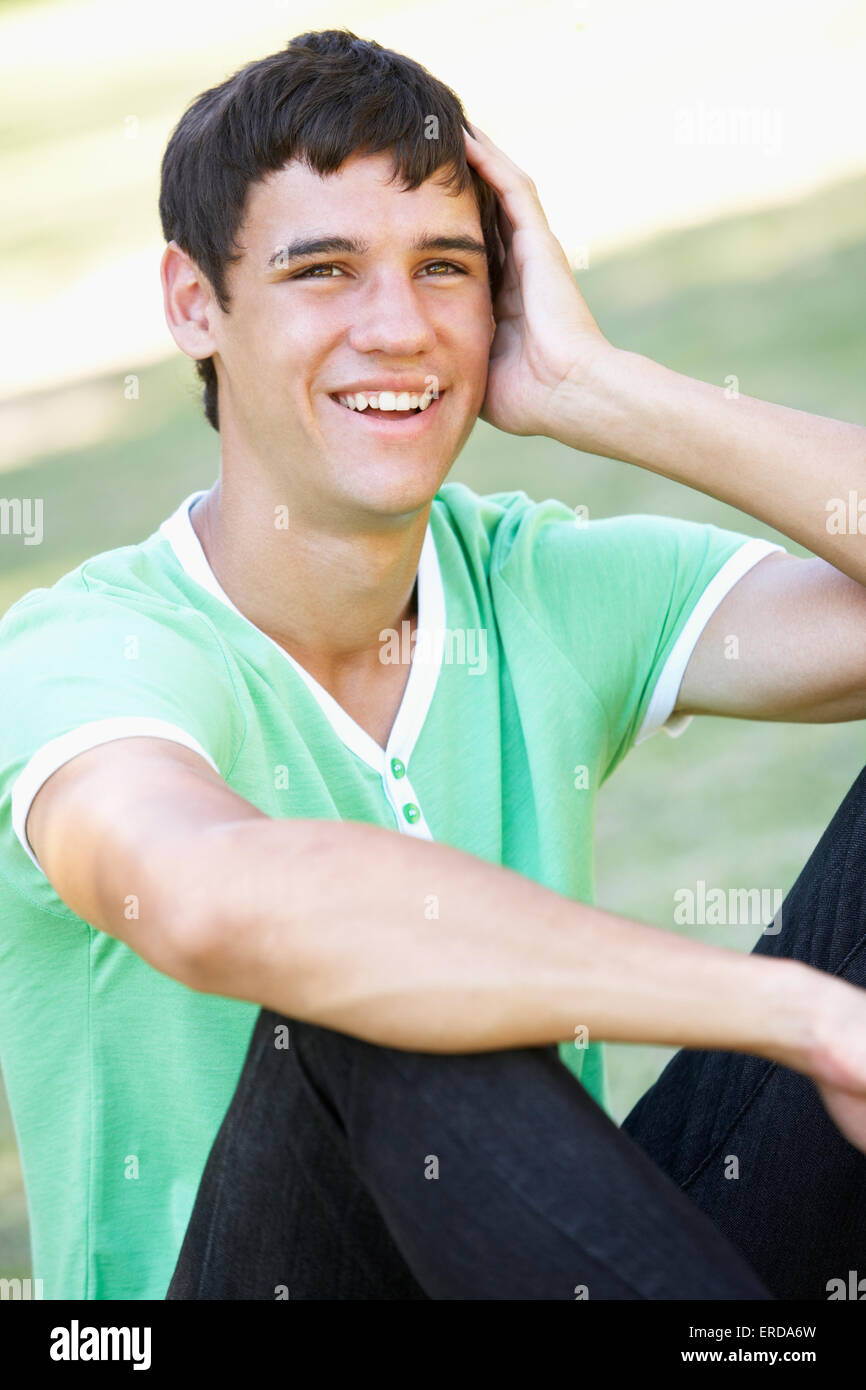 Teenage Boy Relaxing In Park Stock Photo - Alamy