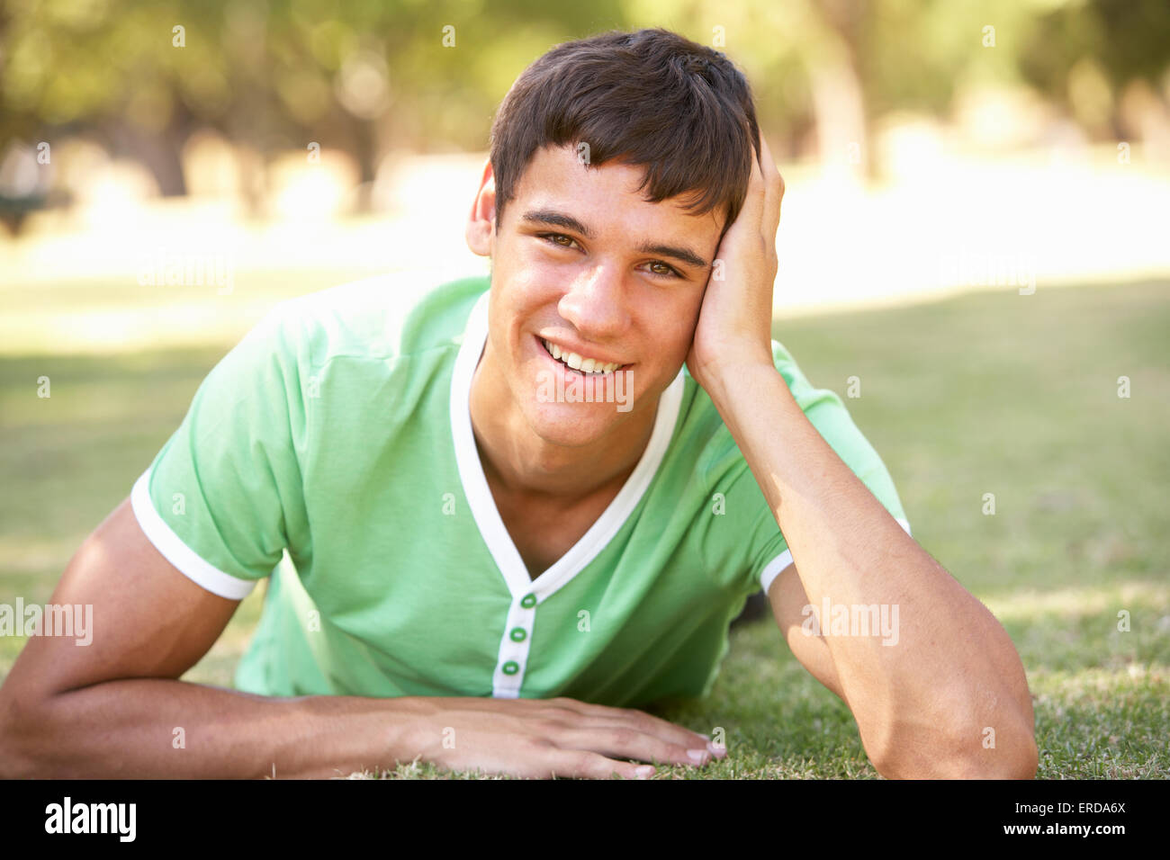 Teenage Boy Relaxing In Park Stock Photo - Alamy