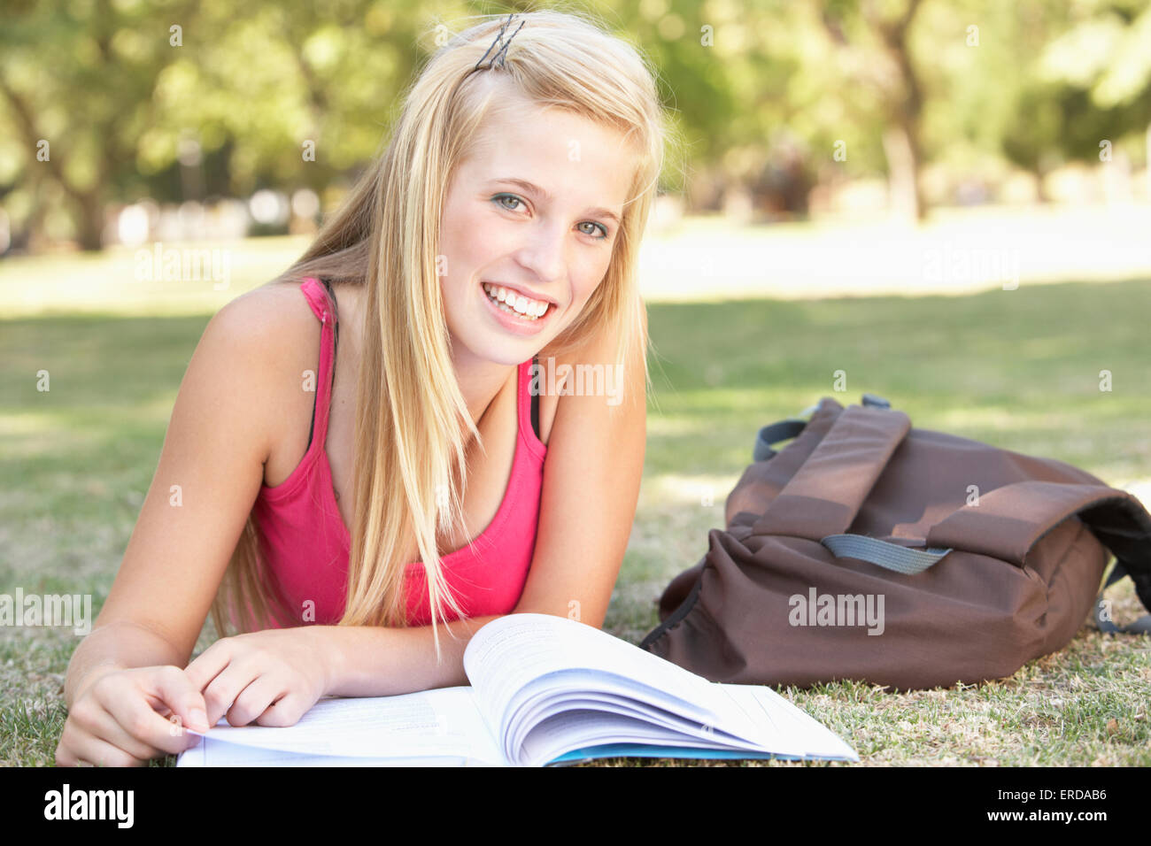 Female Student Studying In Park Stock Photo - Alamy