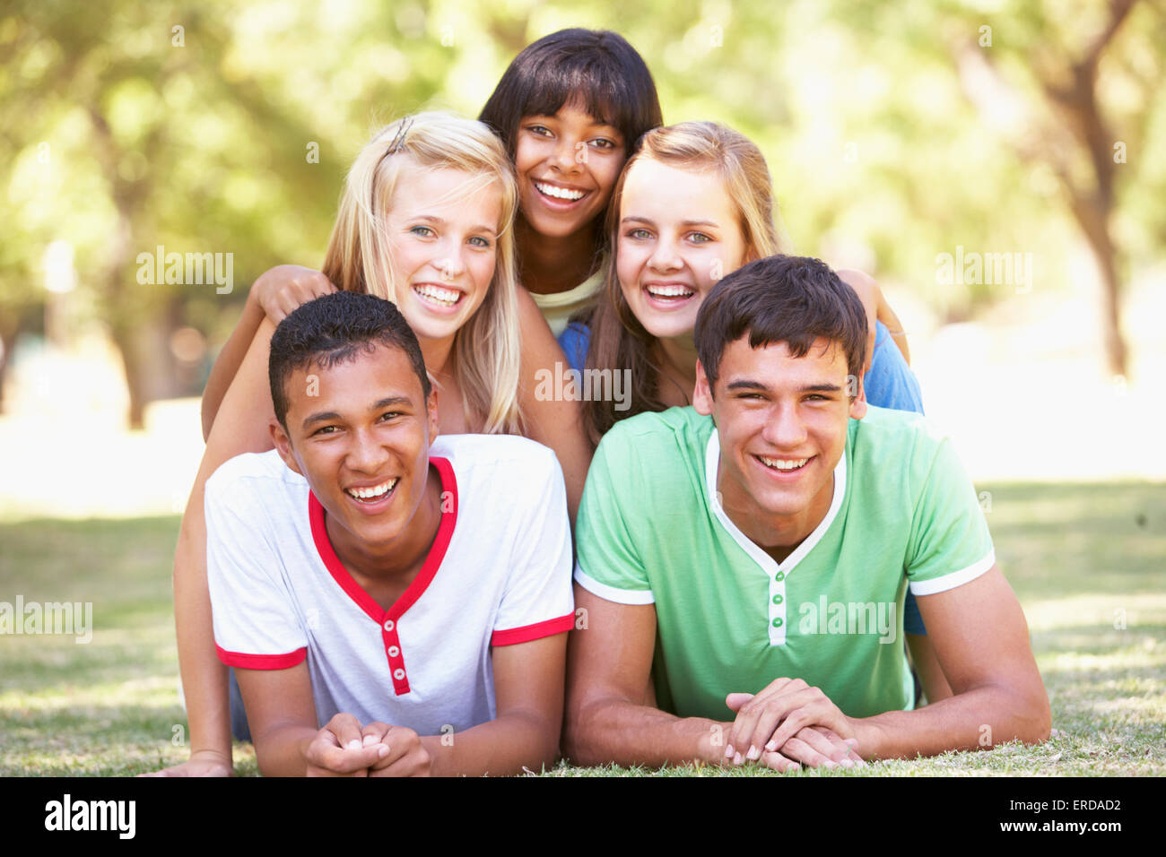 Group Of Teenage Friends Having Fun In Park Stock Photo - Alamy