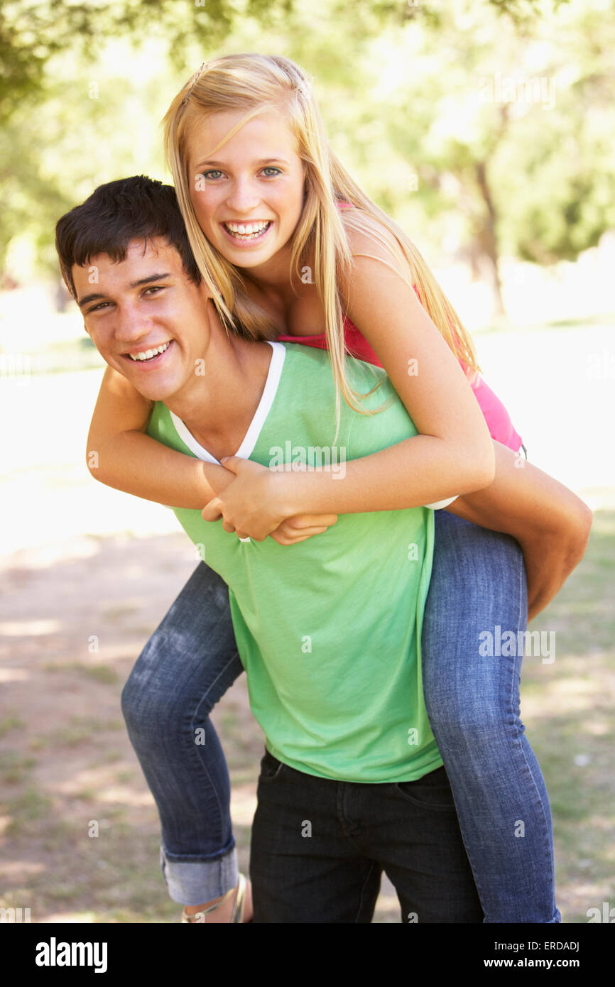 Teenage Couple Having Fun In Park Together Stock Photo - Alamy