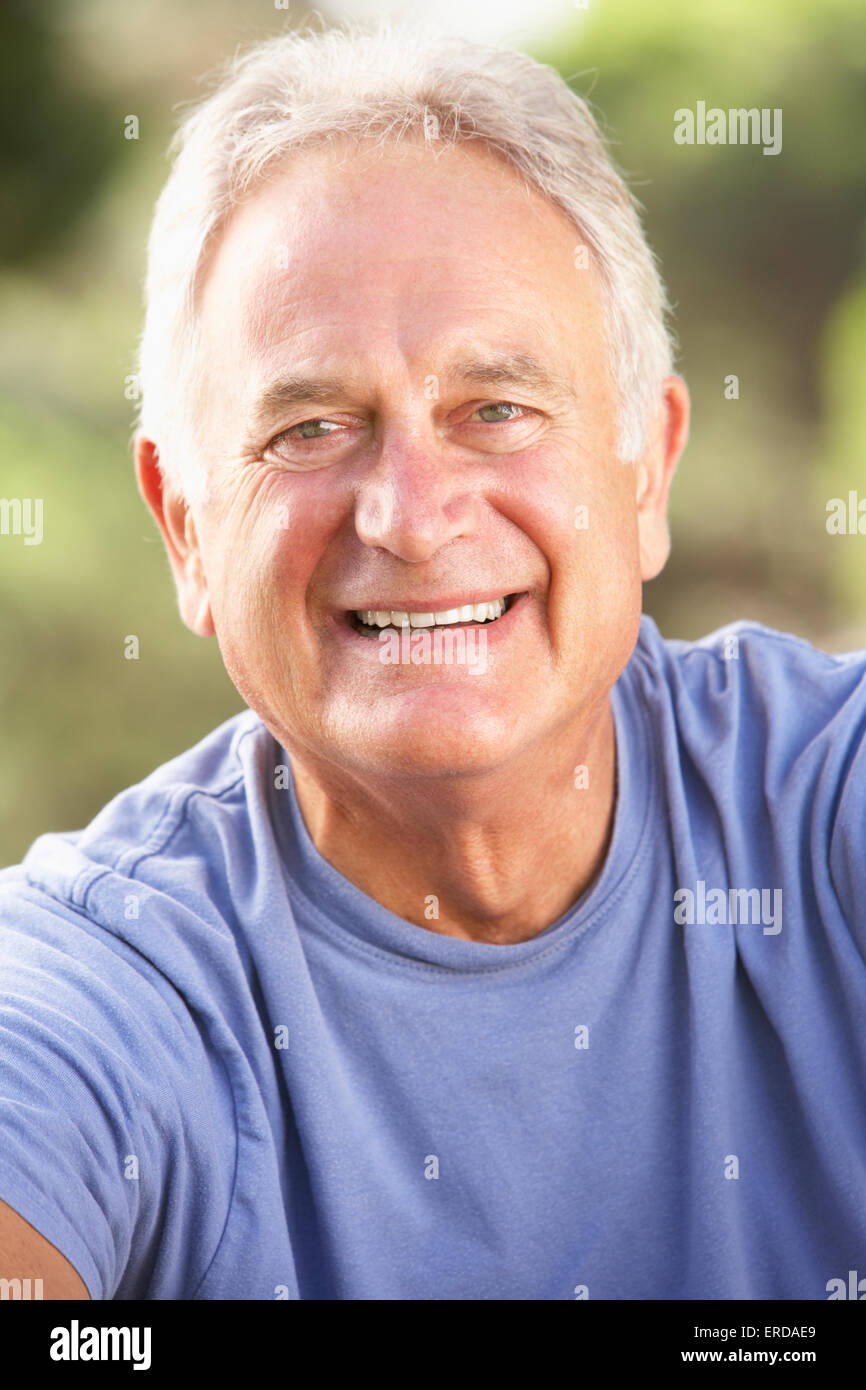 Portrait Of Senior Man Relaxing In Countryside Stock Photo - Alamy