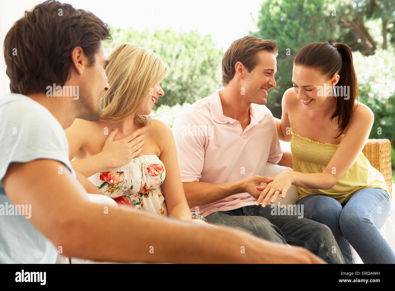 Group Of Young Friends Relaxing On Sofa Stock Photo - Alamy