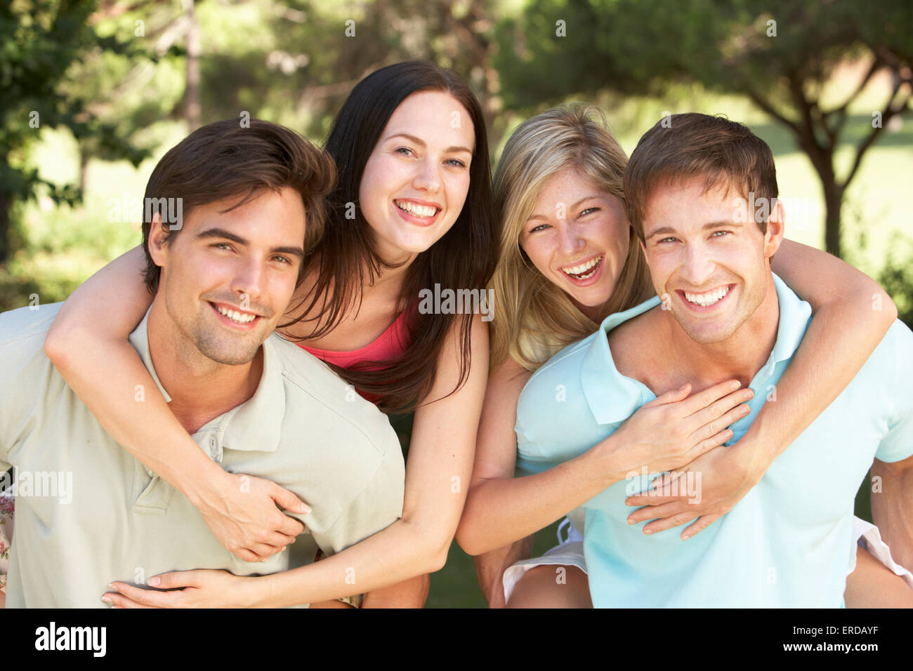 Group Of Young Having Fun In Countryside Together Stock Photo - Alamy