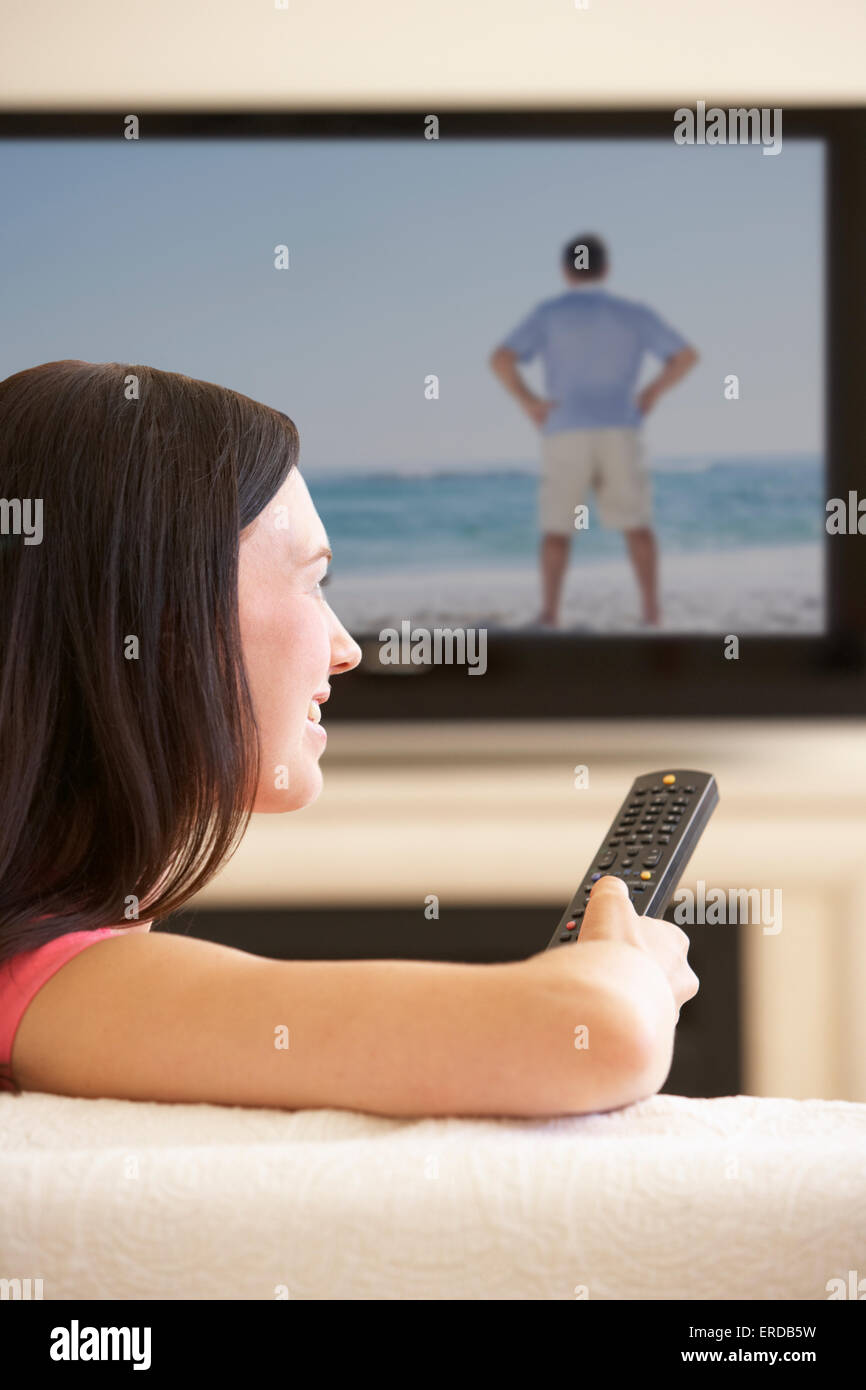 Woman Watching Widescreen TV At Home Stock Photo - Alamy