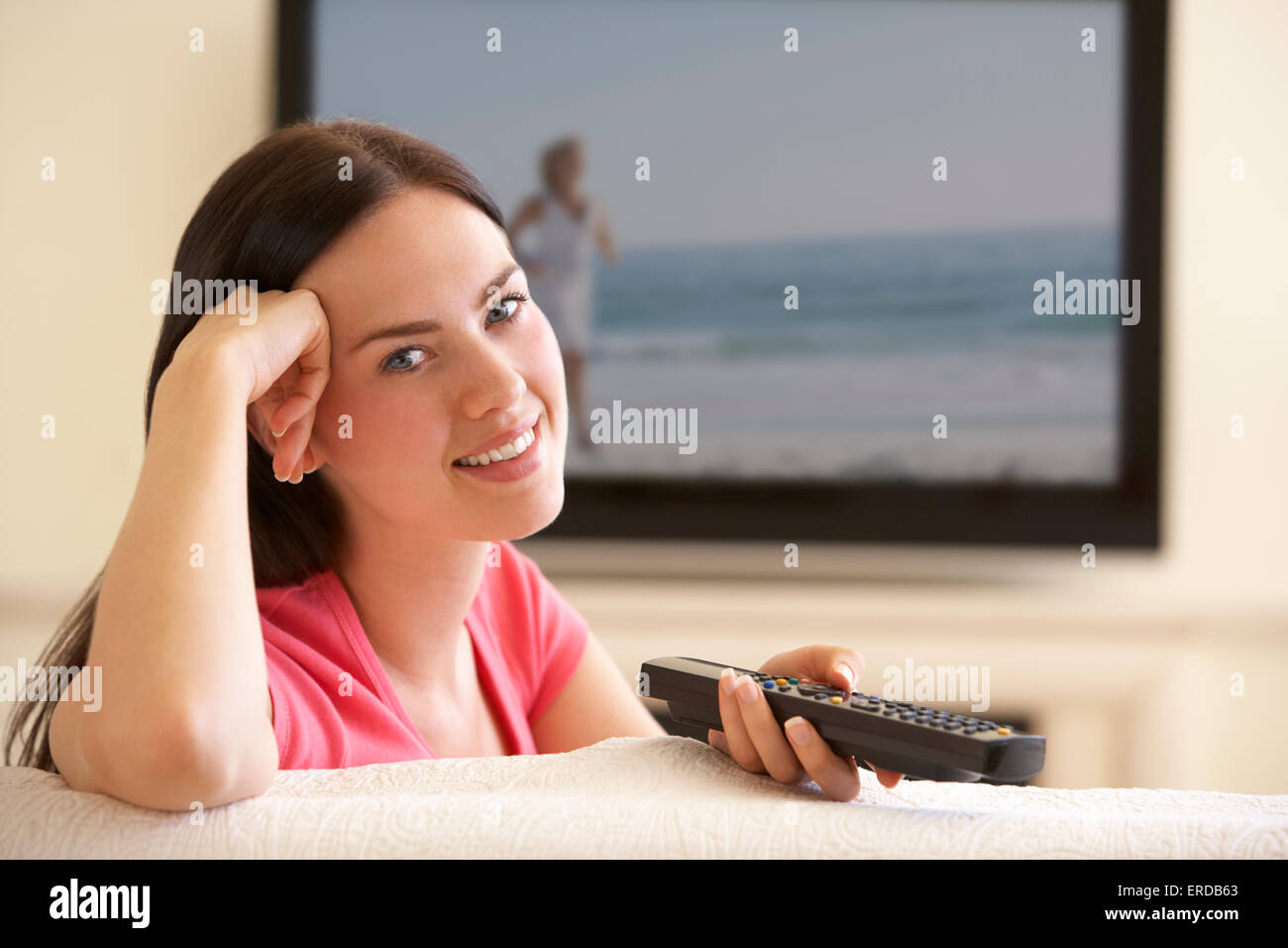 Woman Watching Widescreen TV At Home Stock Photo - Alamy