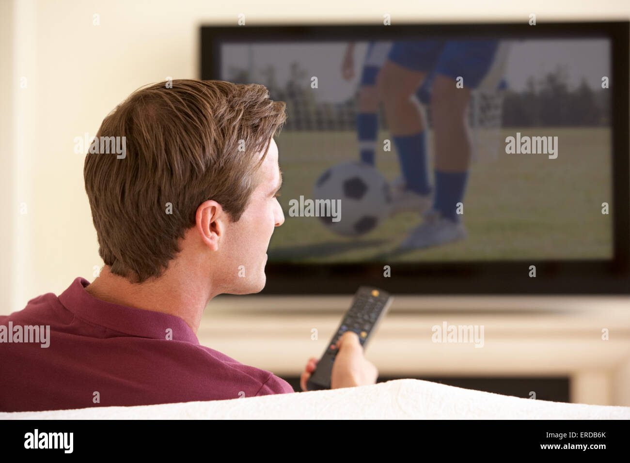 Man Watching Widescreen TV At Home Stock Photo - Alamy