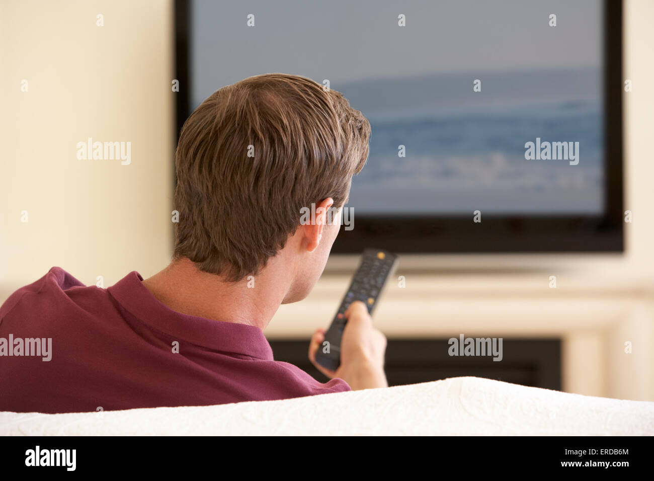 Man Watching Widescreen TV At Home Stock Photo - Alamy