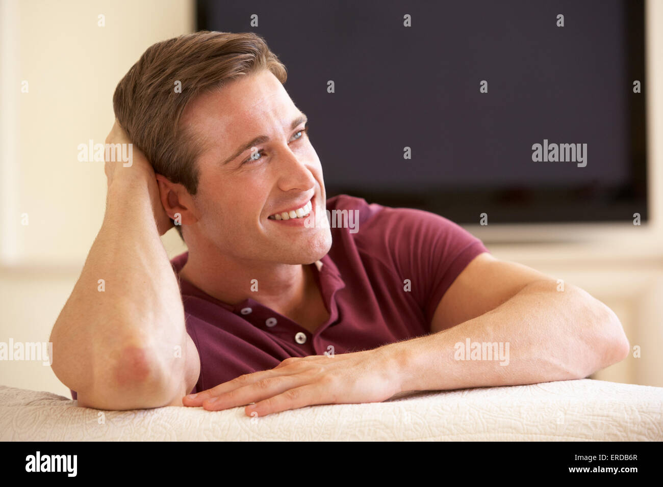 Man Watching Widescreen TV At Home Stock Photo - Alamy