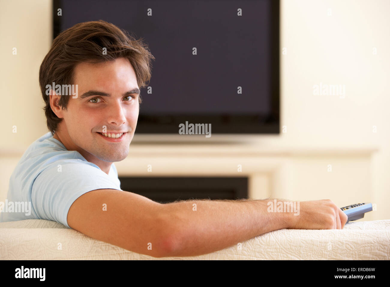 Man Watching Widescreen TV At Home Stock Photo - Alamy