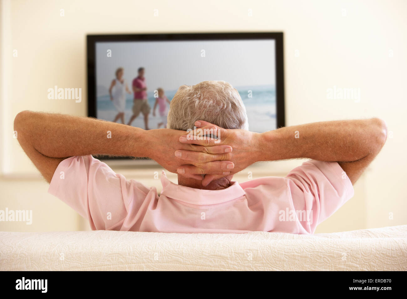 Senior Man Watching Widescreen TV At Home Stock Photo - Alamy