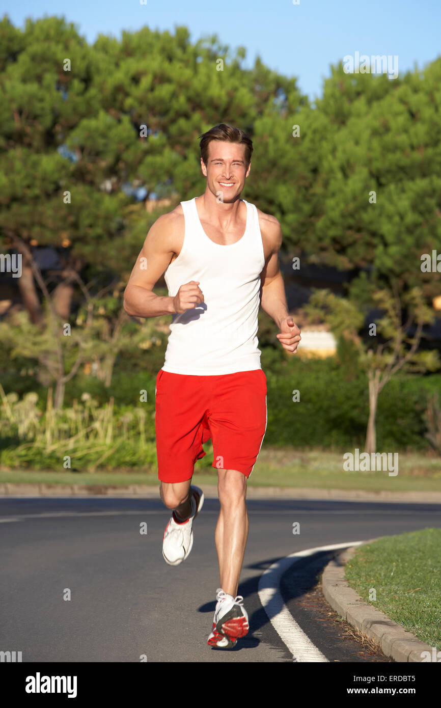 Man Running On Road Stock Photo - Alamy