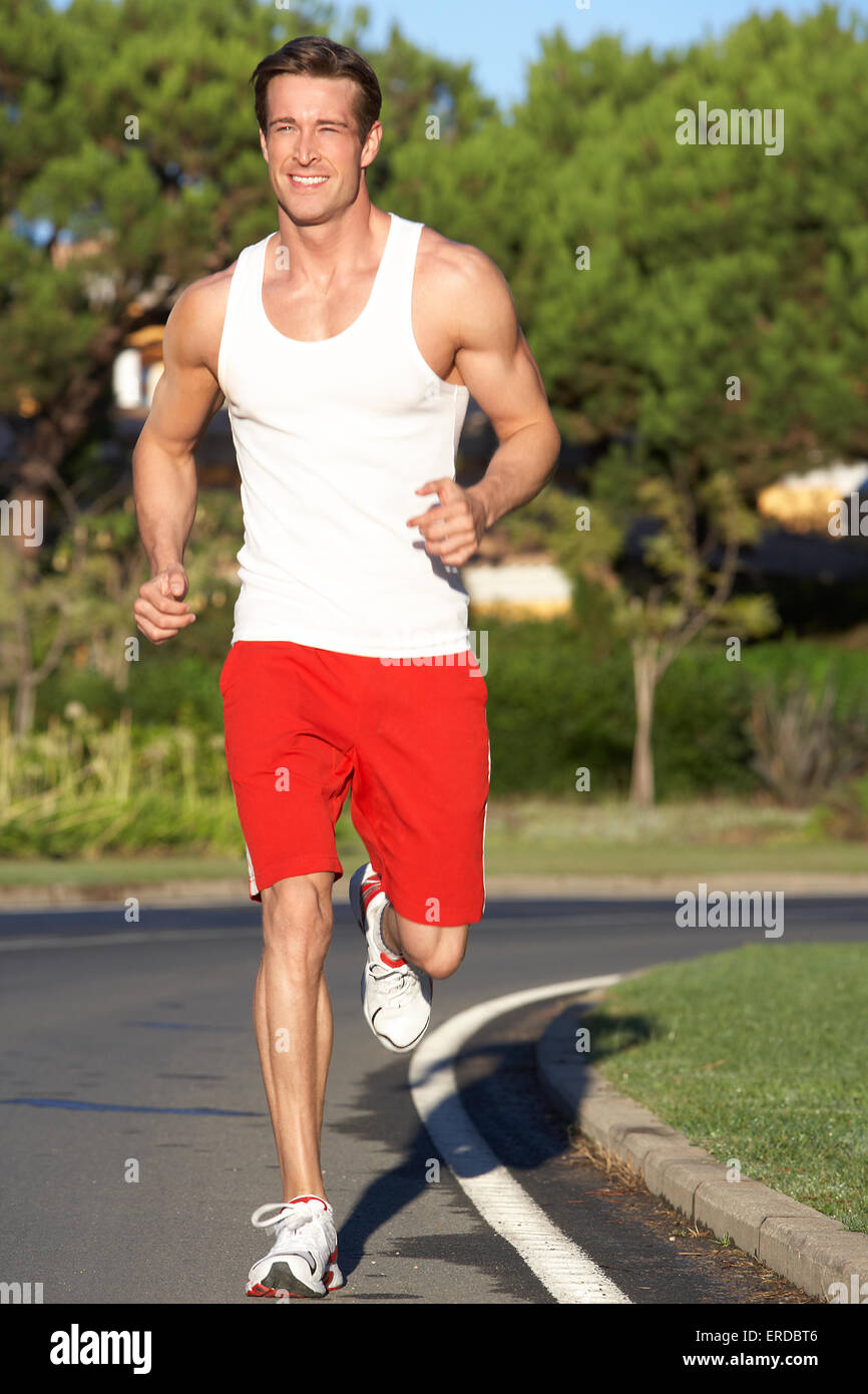 Man Running On Road Stock Photo - Alamy