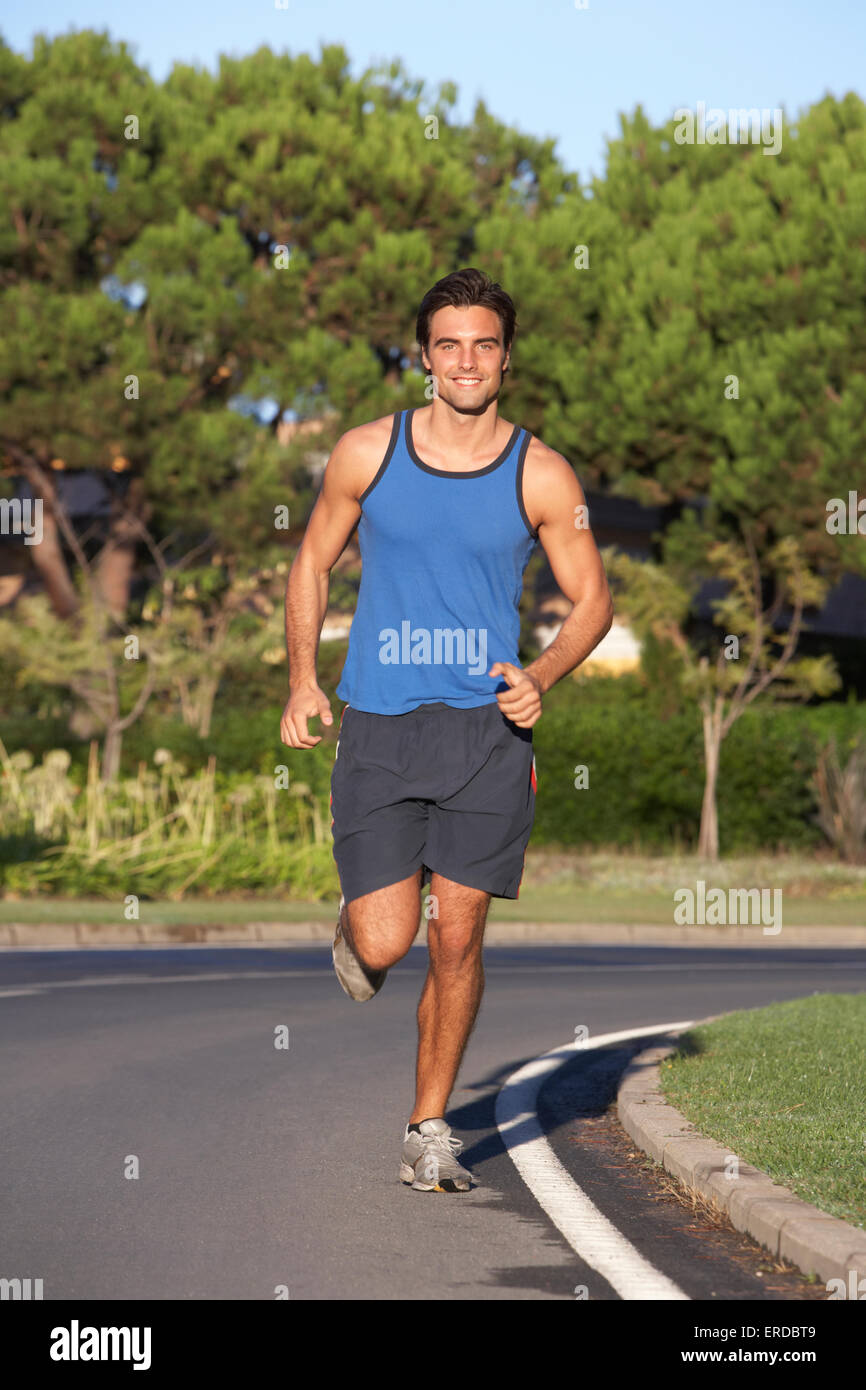 Man Running On Road Stock Photo - Alamy