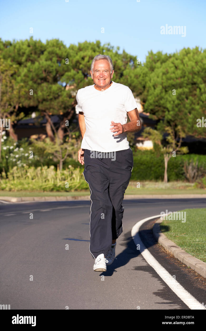 Running older male athlete hi-res stock photography and images - Alamy