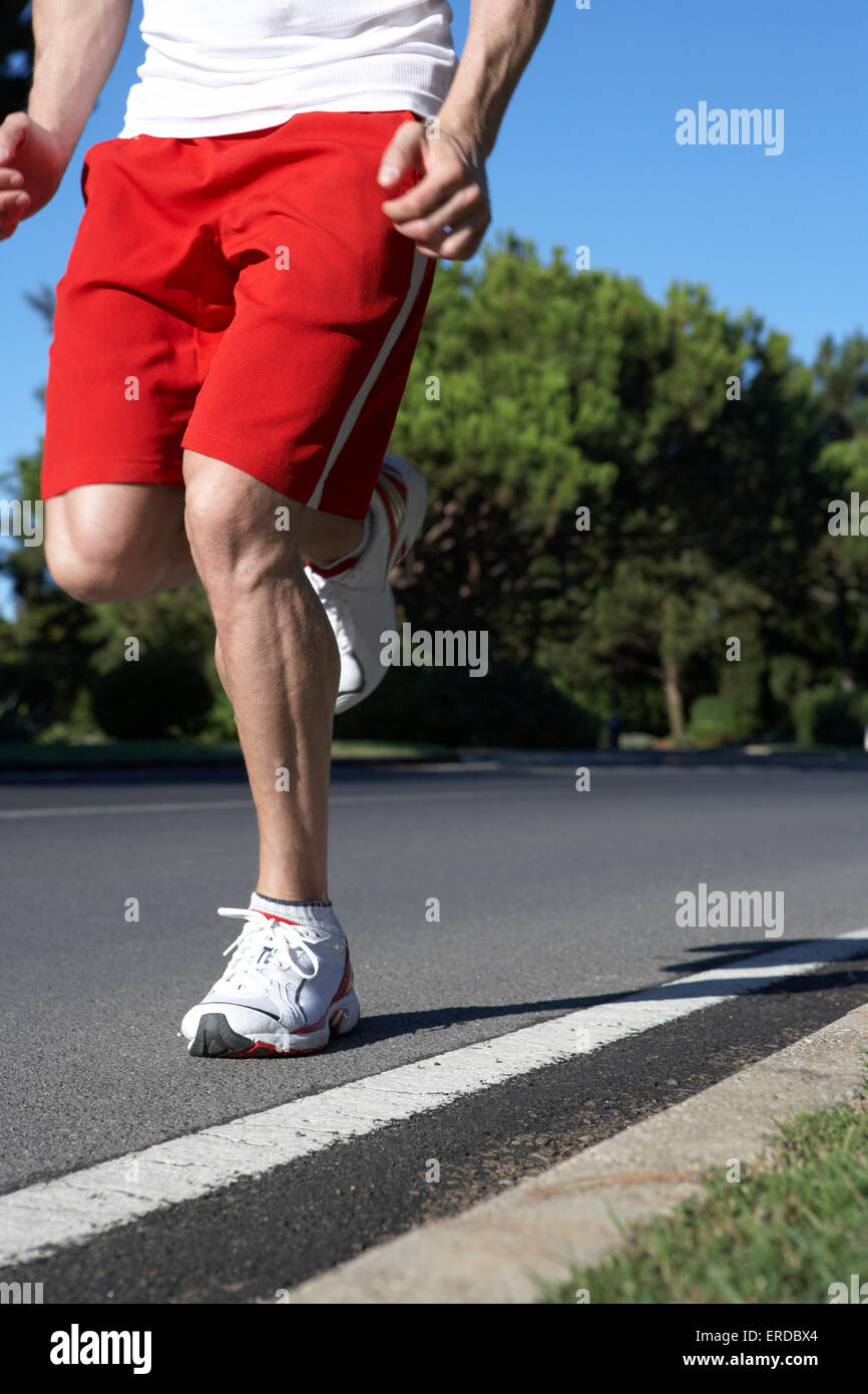Man legs running on road hi-res stock photography and images - Alamy