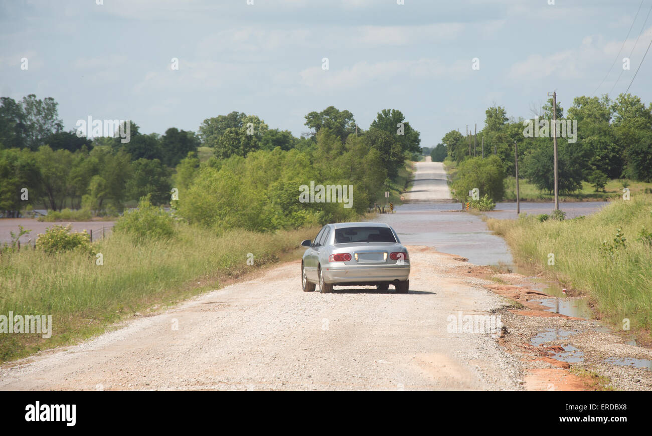 Smart driver backing out to turn around from a flood covered road to ...