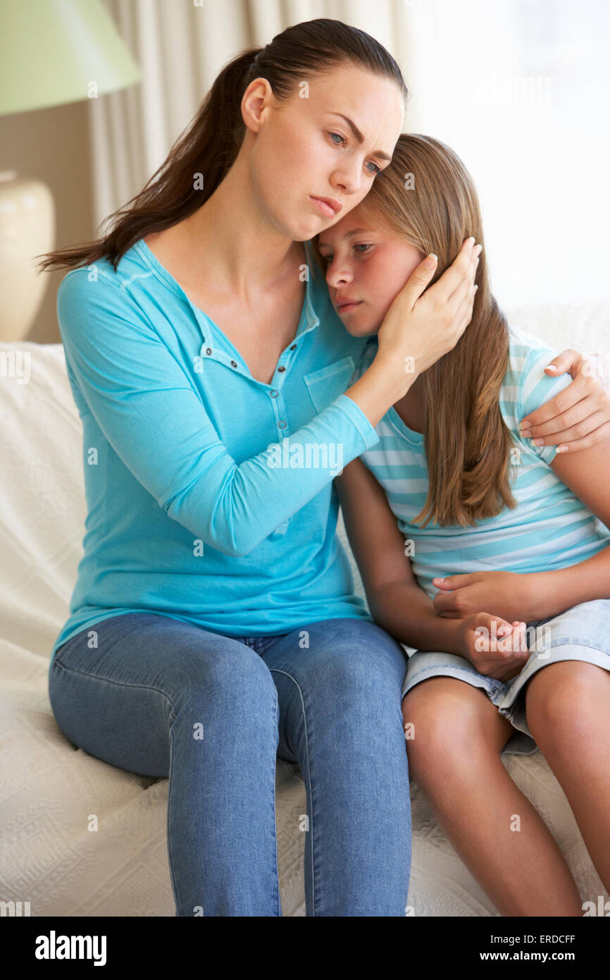Mother Comforting Daughter At Home Stock Photo - Alamy