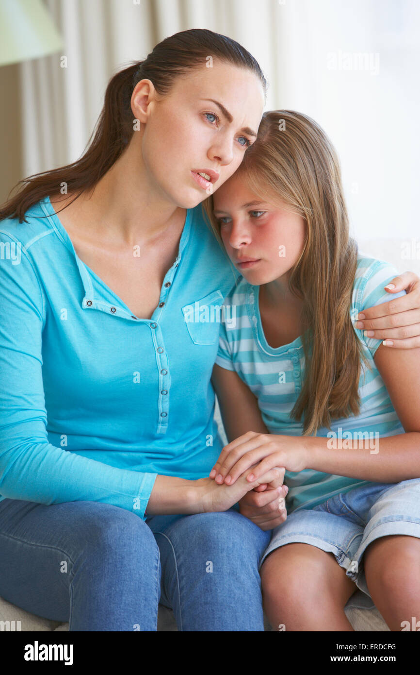 Mother Comforting Daughter At Home Stock Photo - Alamy
