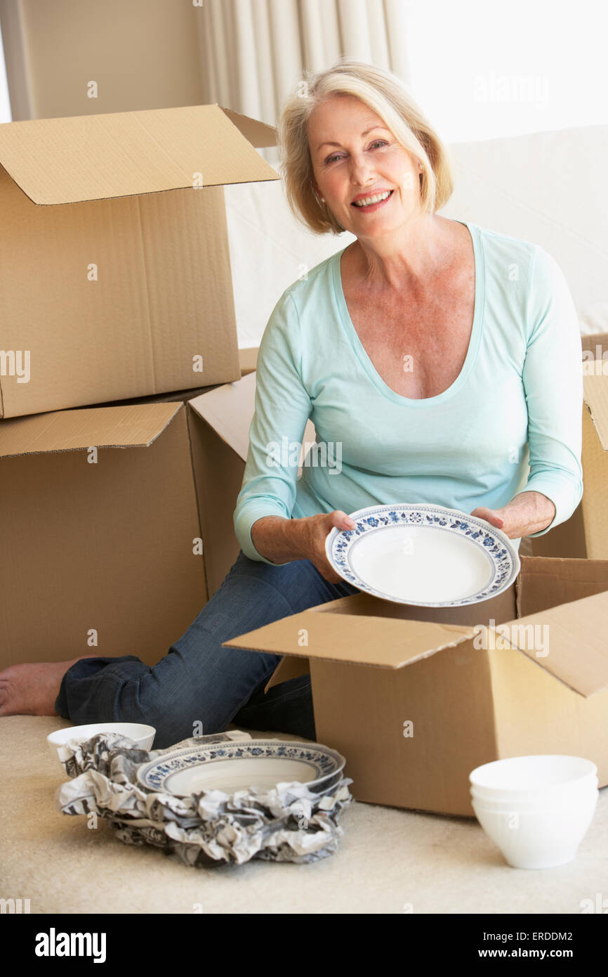 Senior Woman Moving Home And Packing Boxes Stock Photo - Alamy