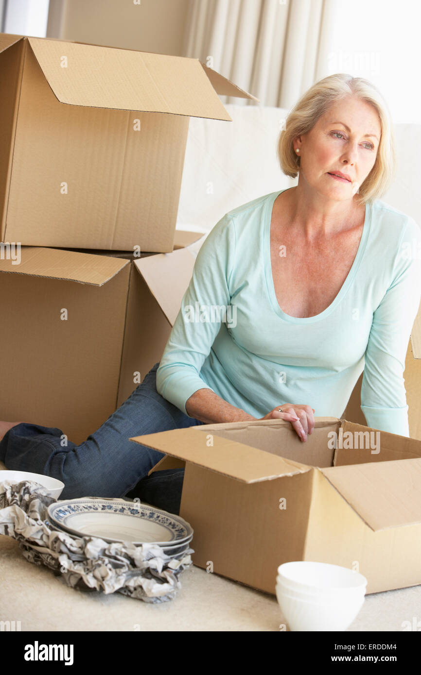 Senior Woman Moving Home And Packing Boxes Stock Photo - Alamy