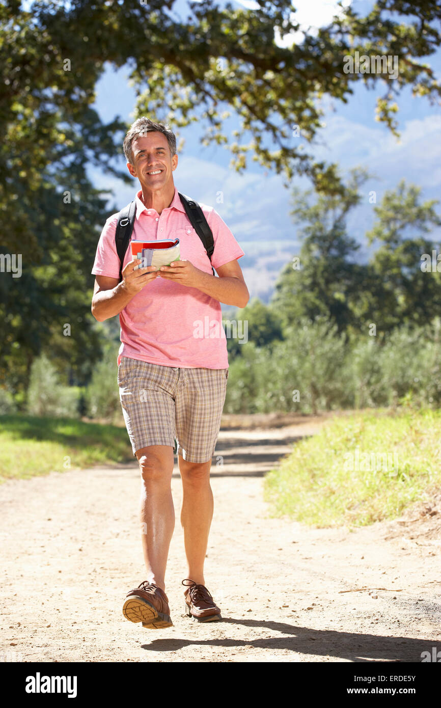 Middle Aged Man Hiking Through Countryside Stock Photo - Alamy
