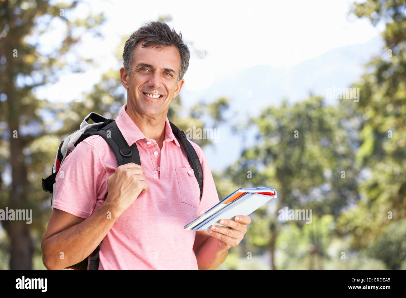 Middle Aged Man Hiking Through Countryside Stock Photo - Alamy