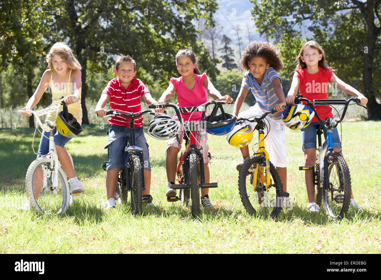 Group Of Children Riding Bikes In Countryside Stock Photo - Alamy