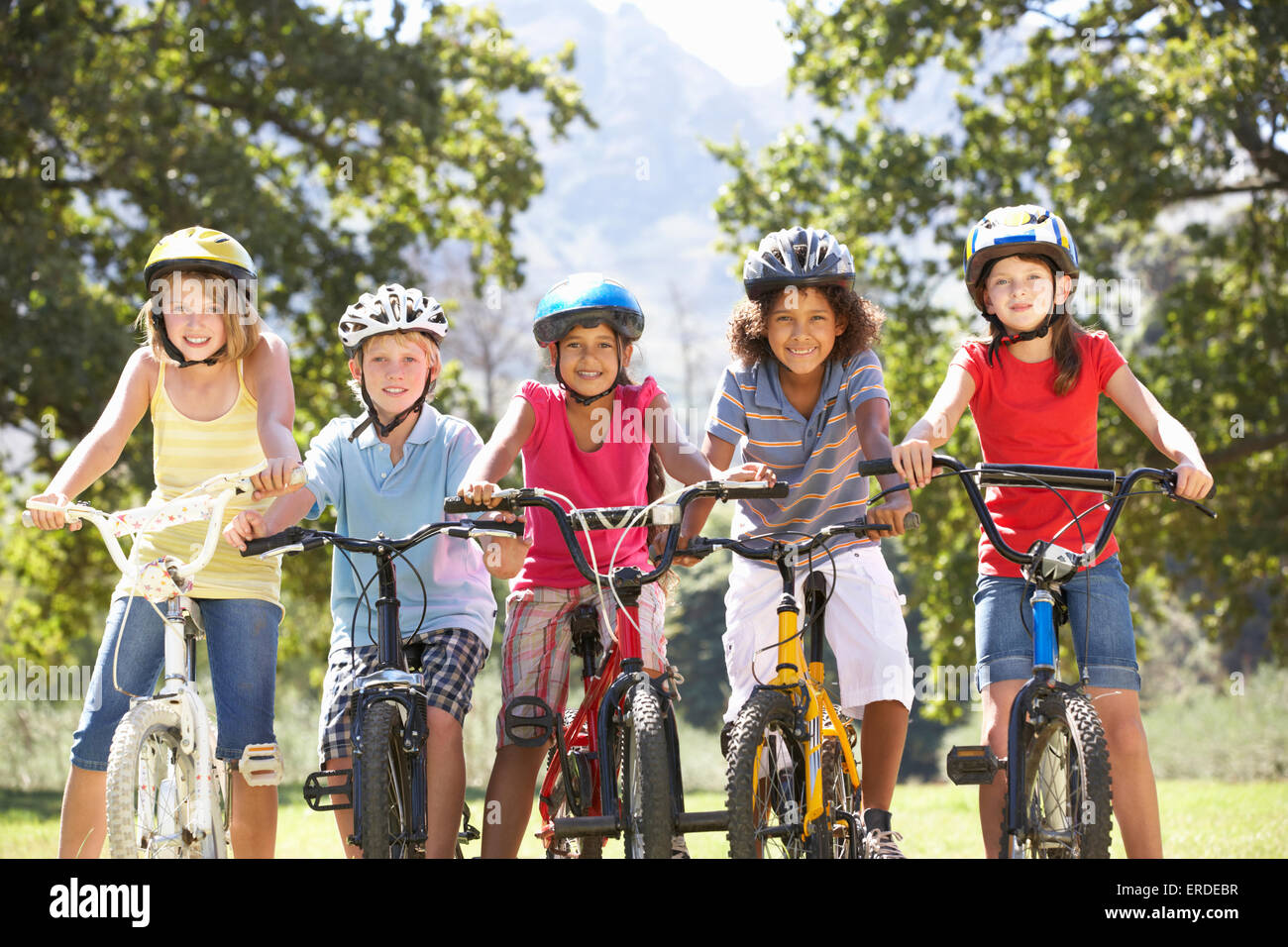 Group Of Children Riding Bikes In Countryside Stock Photo - Alamy