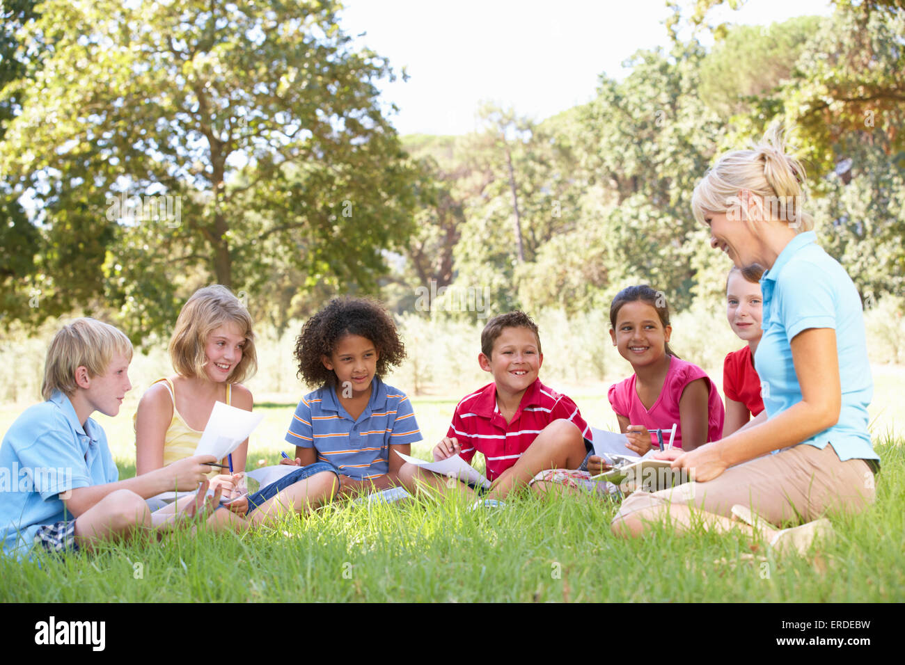 Group Of Having Art Lesson With Instructor In Countryside Stock Photo ...