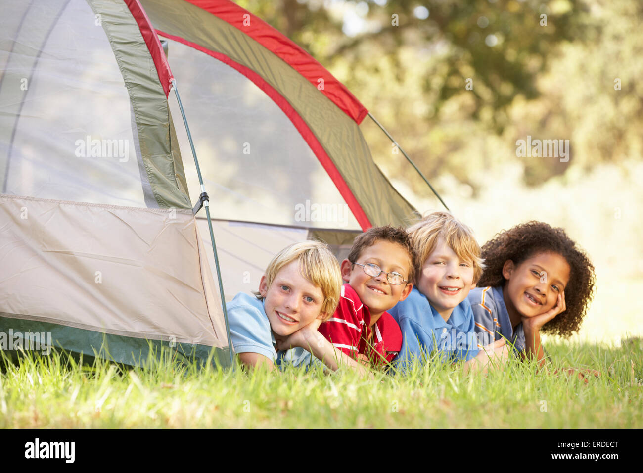 Group Of Boys Having Fun In Tent In Countryside Stock Photo - Alamy