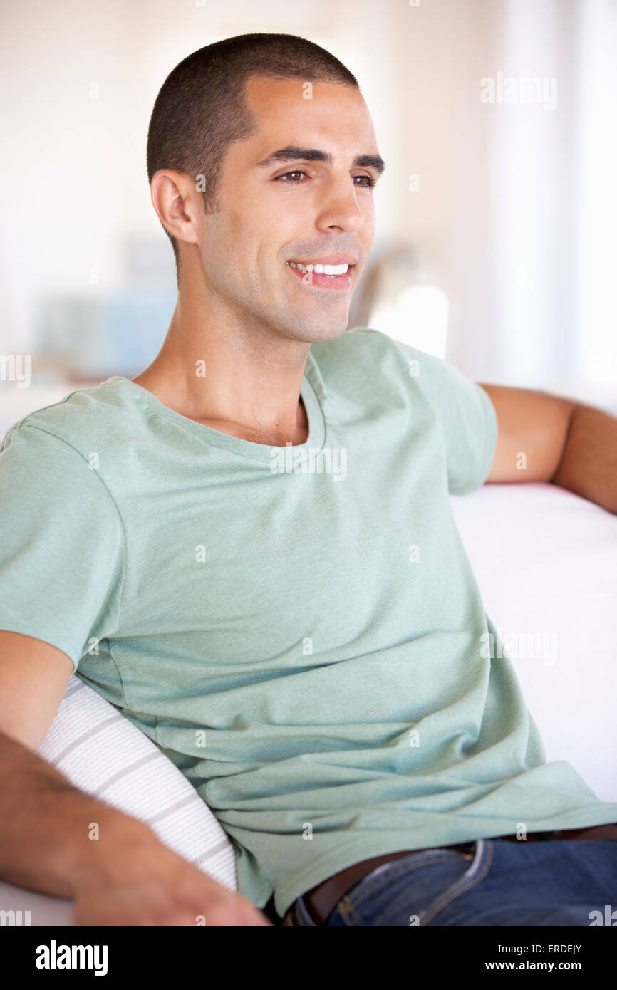 Young Man Relaxing At Home Stock Photo - Alamy