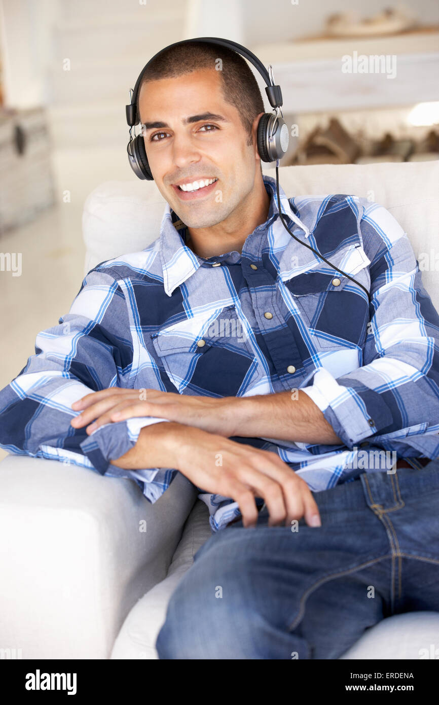 Young Man Relaxing Listening To Music At Home Stock Photo - Alamy