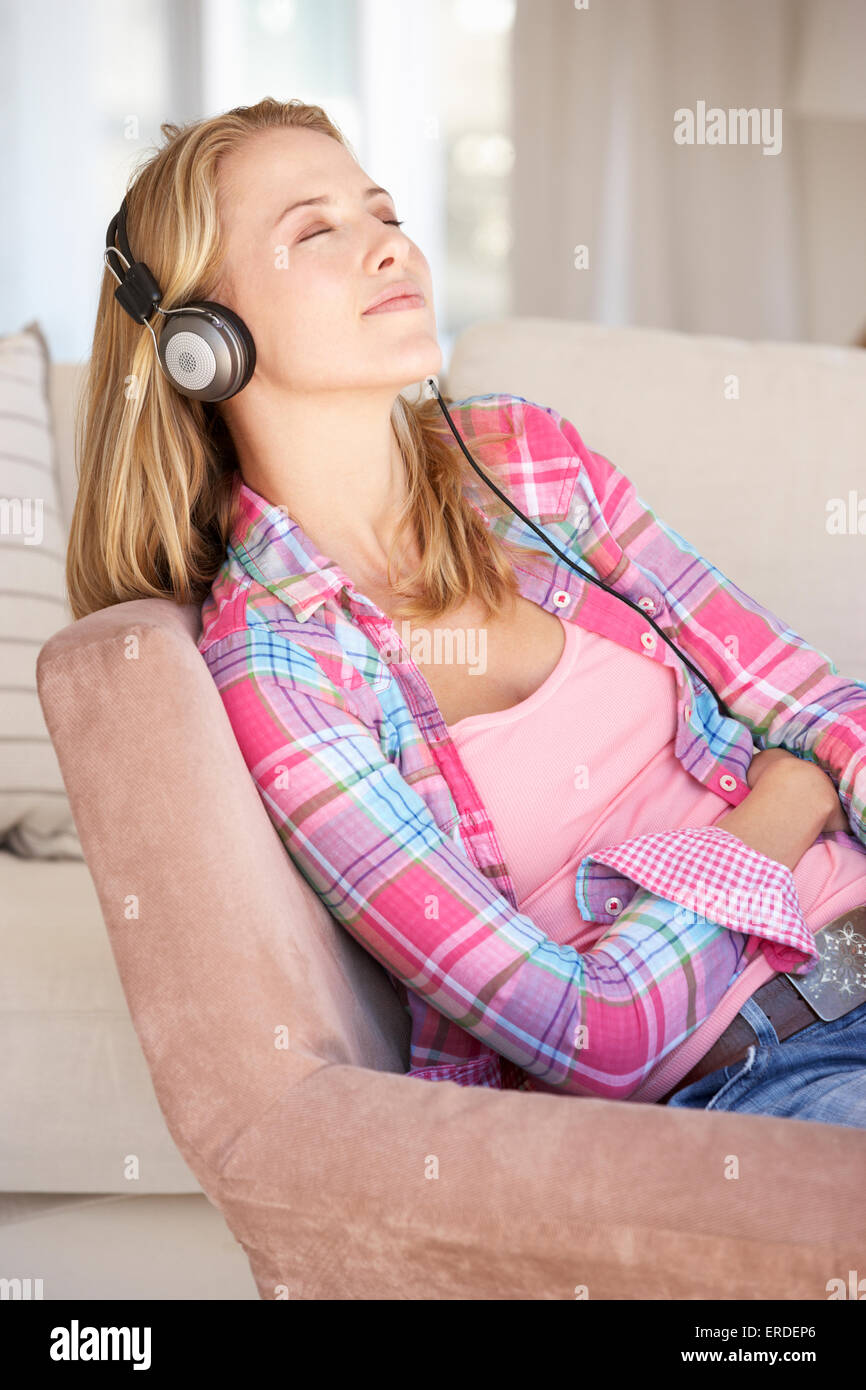 Young Woman Relaxing Listening To Music At Home Stock Photo - Alamy