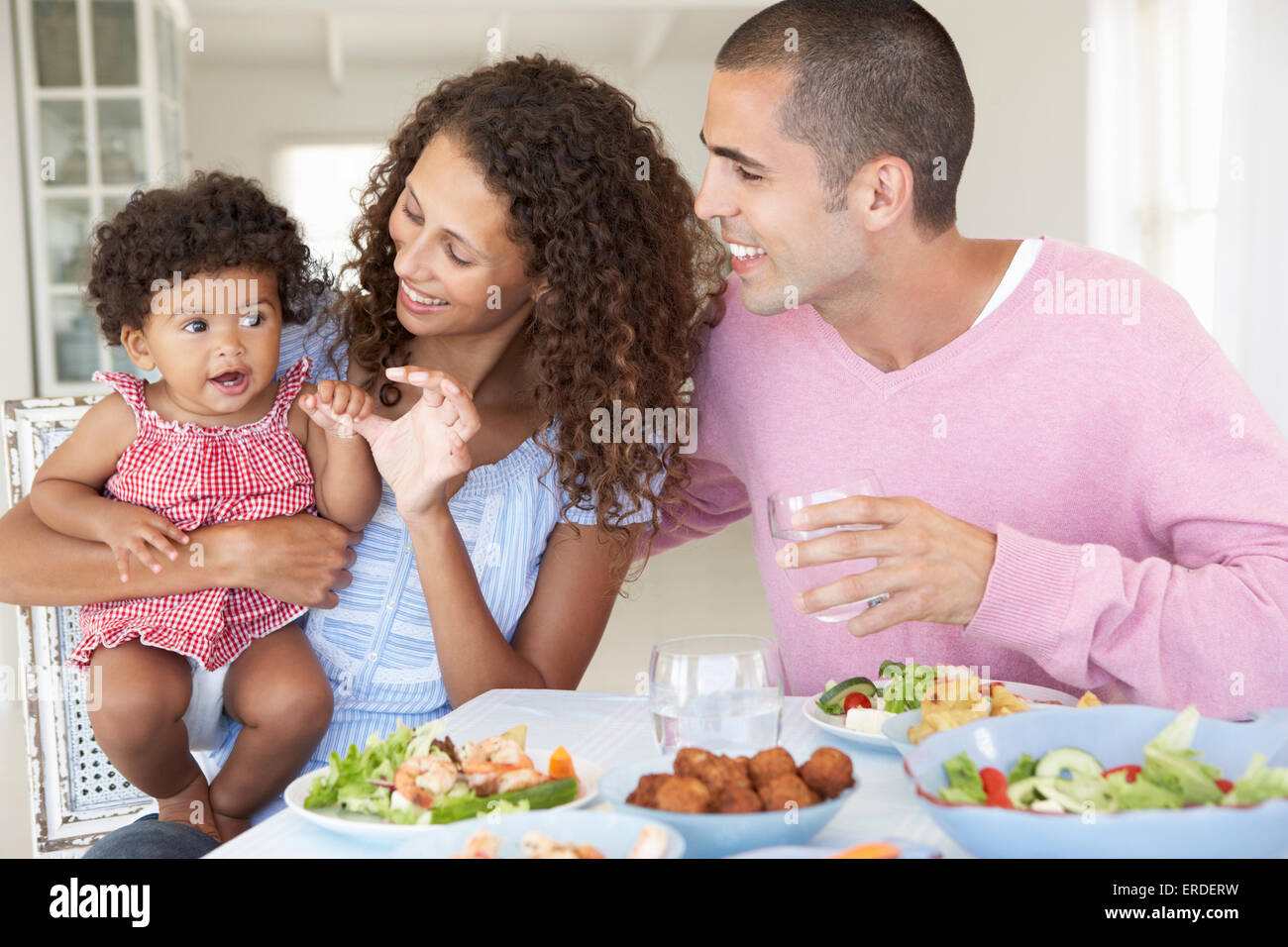 Family Enjoying Meal Together At Home Stock Photo - Alamy