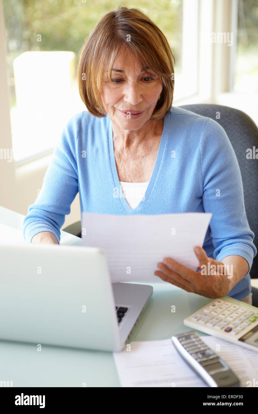 Senior Hispanic Woman Working In Home Office Stock Photo - Alamy