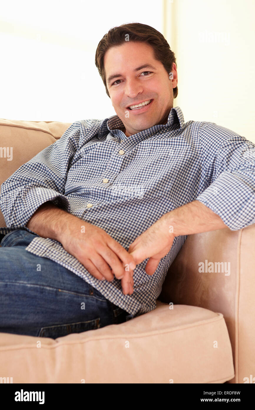 Hispanic Man Relaxing At Home Stock Photo - Alamy